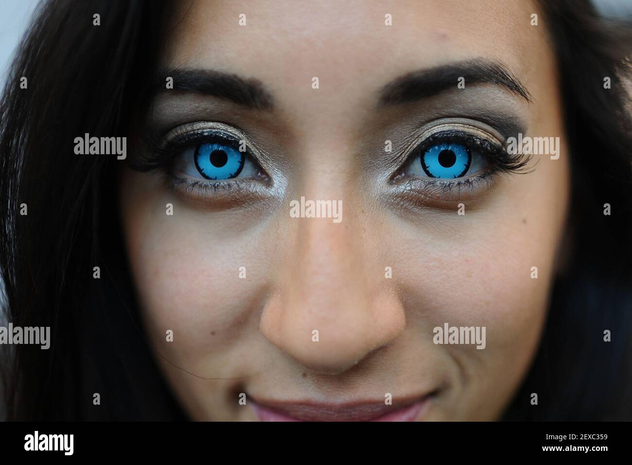 Wearing colored contact lenses, Kim Chin attends the 2015 New York ...