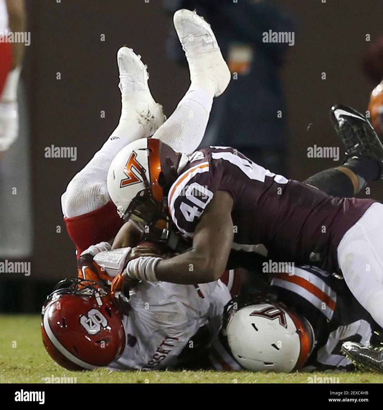 Virginia Tech's Woody Baron (60) and Deon Clarke (40) sack North ...