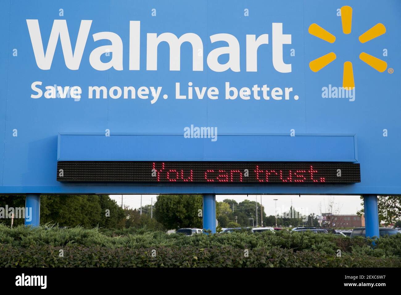 A logo sign outside of the Walmart headquarters, known as the Home ...