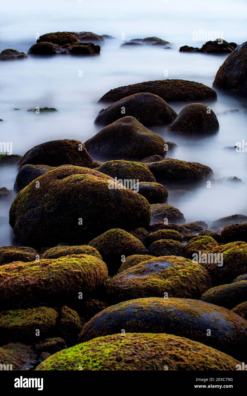 photography of rocks in the sea with haze effect Stock Photo - Alamy