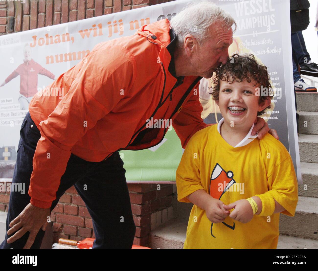 Dutch soccer legend Johan Cruyff (L) with young boy fan during the ...
