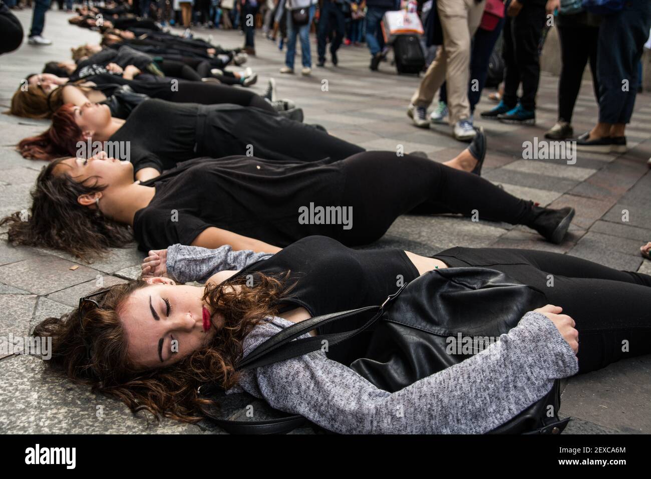 Women lay down on the floor during a performance carried out by "Women ...