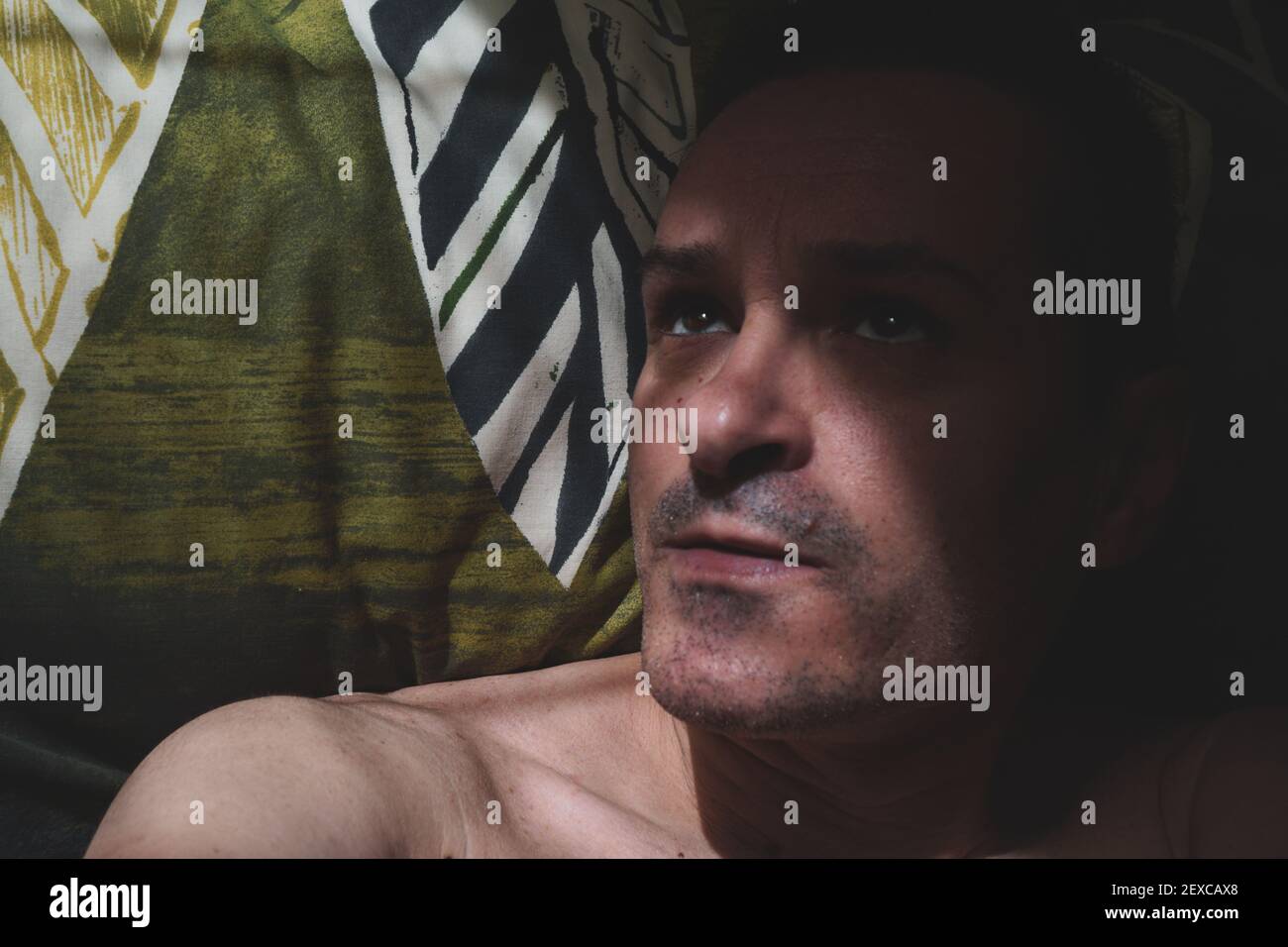 Man waking up in bed hi-res stock photography and images - Alamy