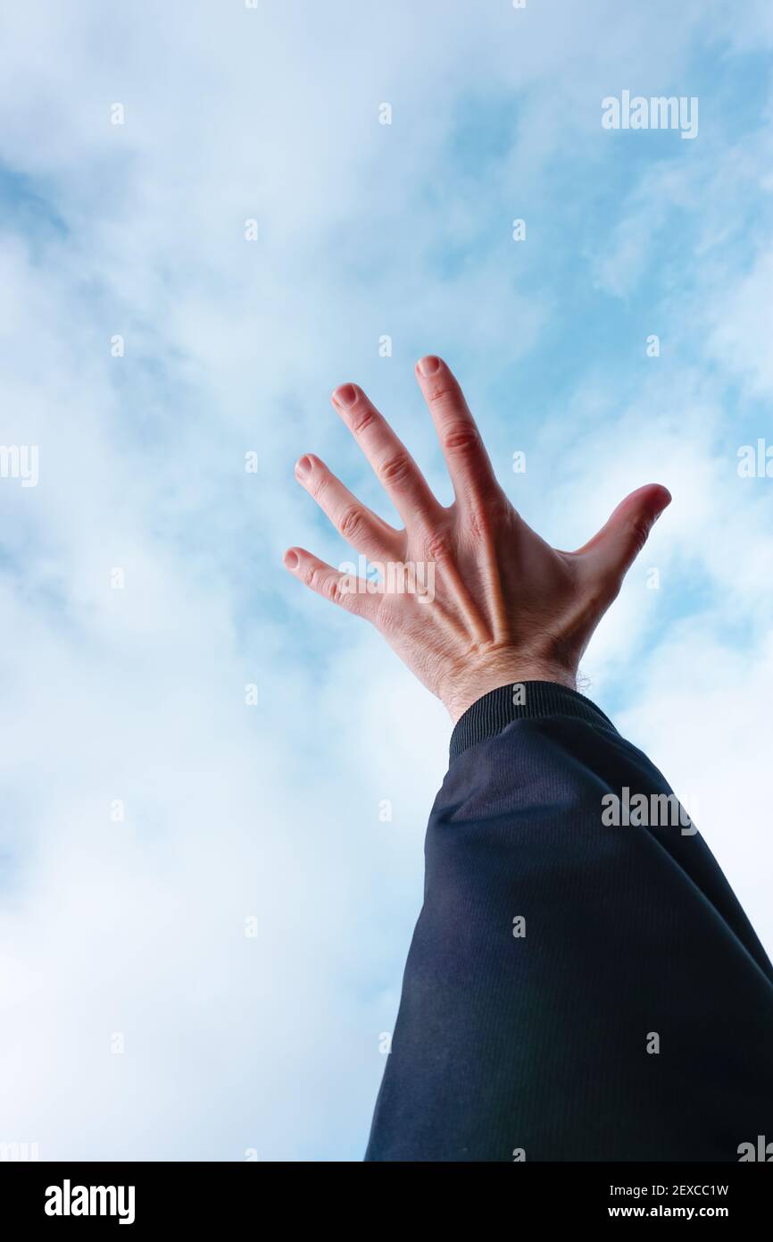 man hand gesturing with the blue sky Stock Photo - Alamy