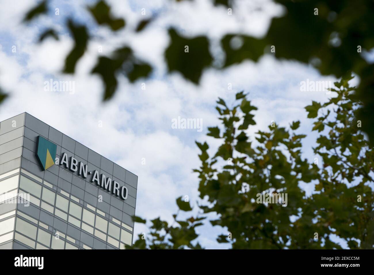 A logo sign outside of the headquarters of ABN AMRO Bank N.V. in ...