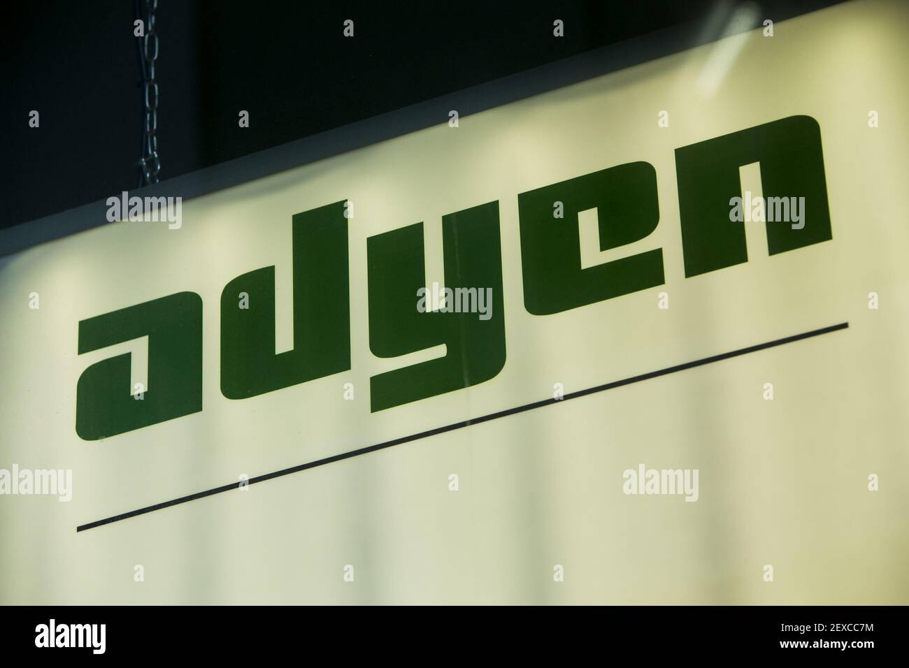 A logo sign outside of the headquarters of Adyen in Amsterdam ...
