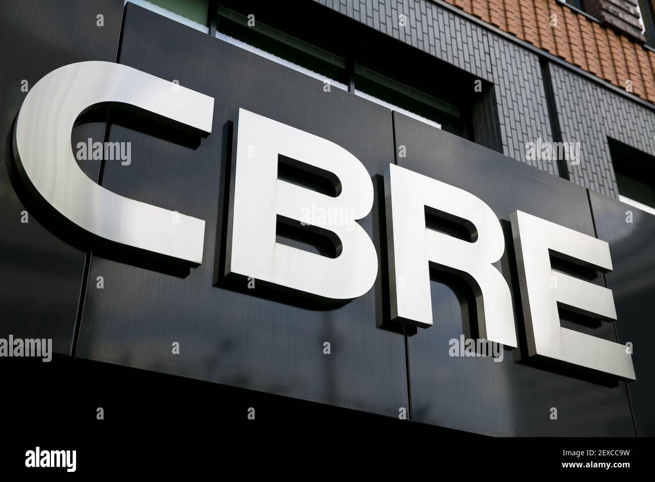 A logo sign outside of an office building occupied by CBRE Group in ...