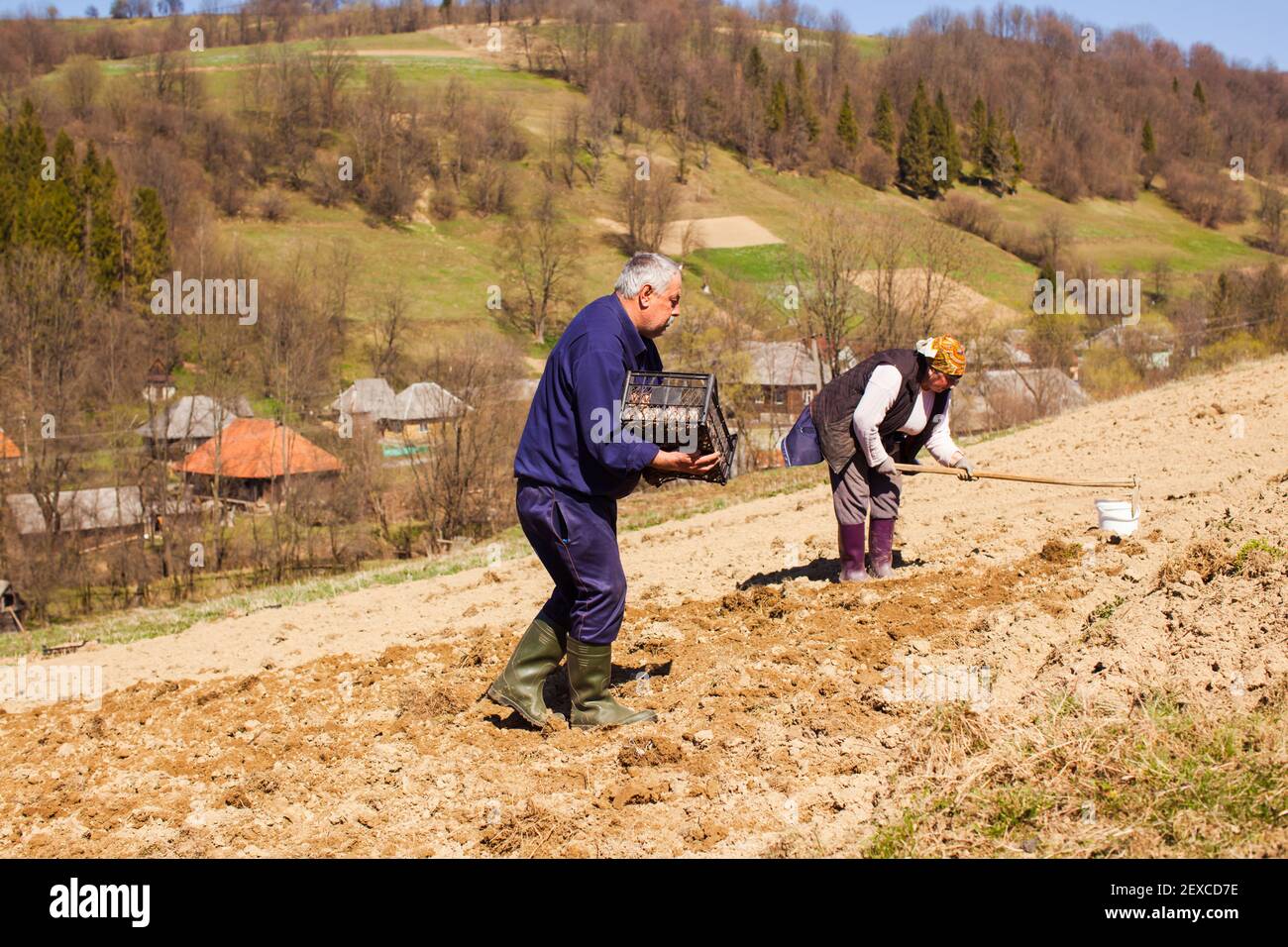 Working on a soil at mountaing village Stock Photo - Alamy