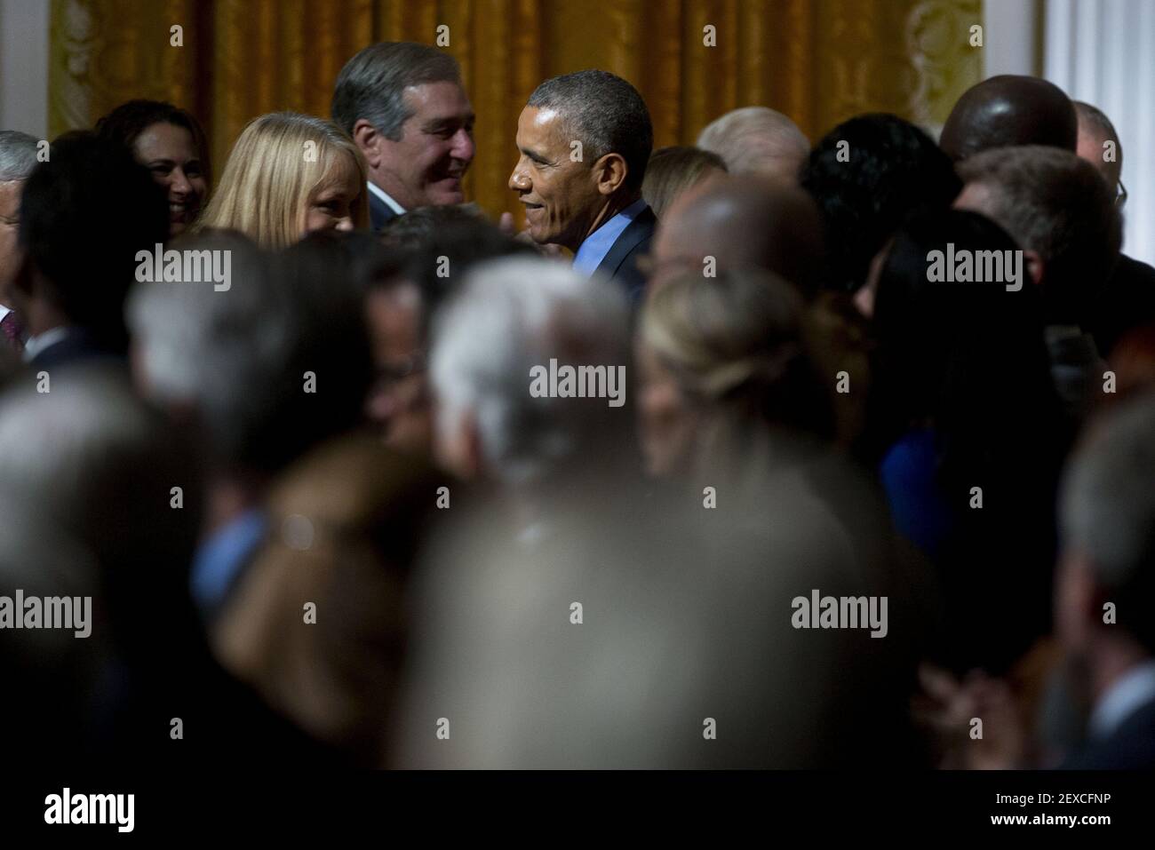 U.S. President Barack Obama, center, arrives to speak during an"In ...