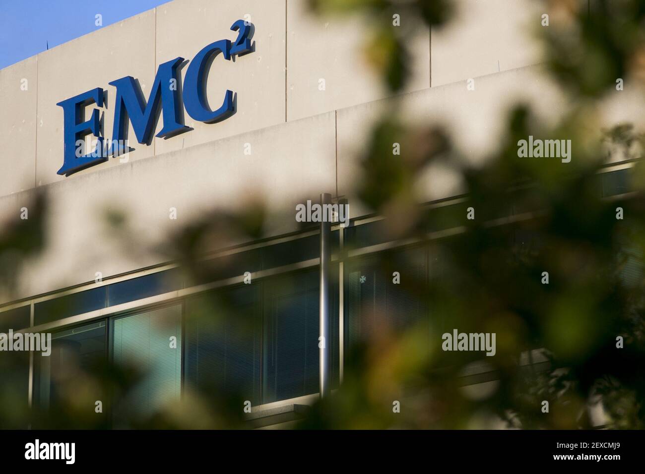 A logo sign outside of an office building occupied by EMC Corporation ...