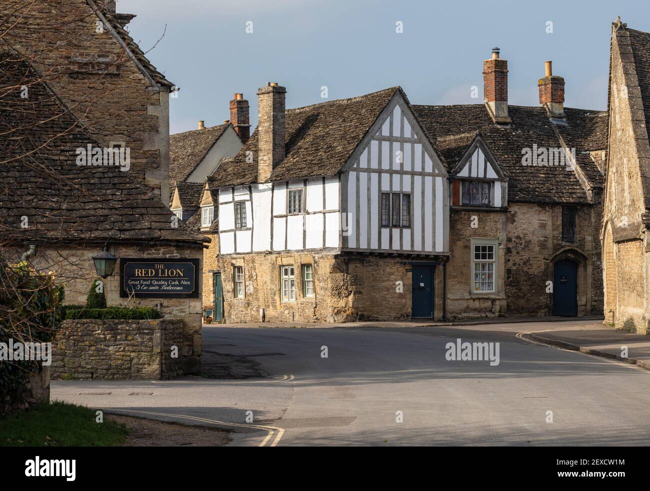 Picturesque Village Of Lacock With Half Timerbered Houses And Sign Of The Red Lion Public House