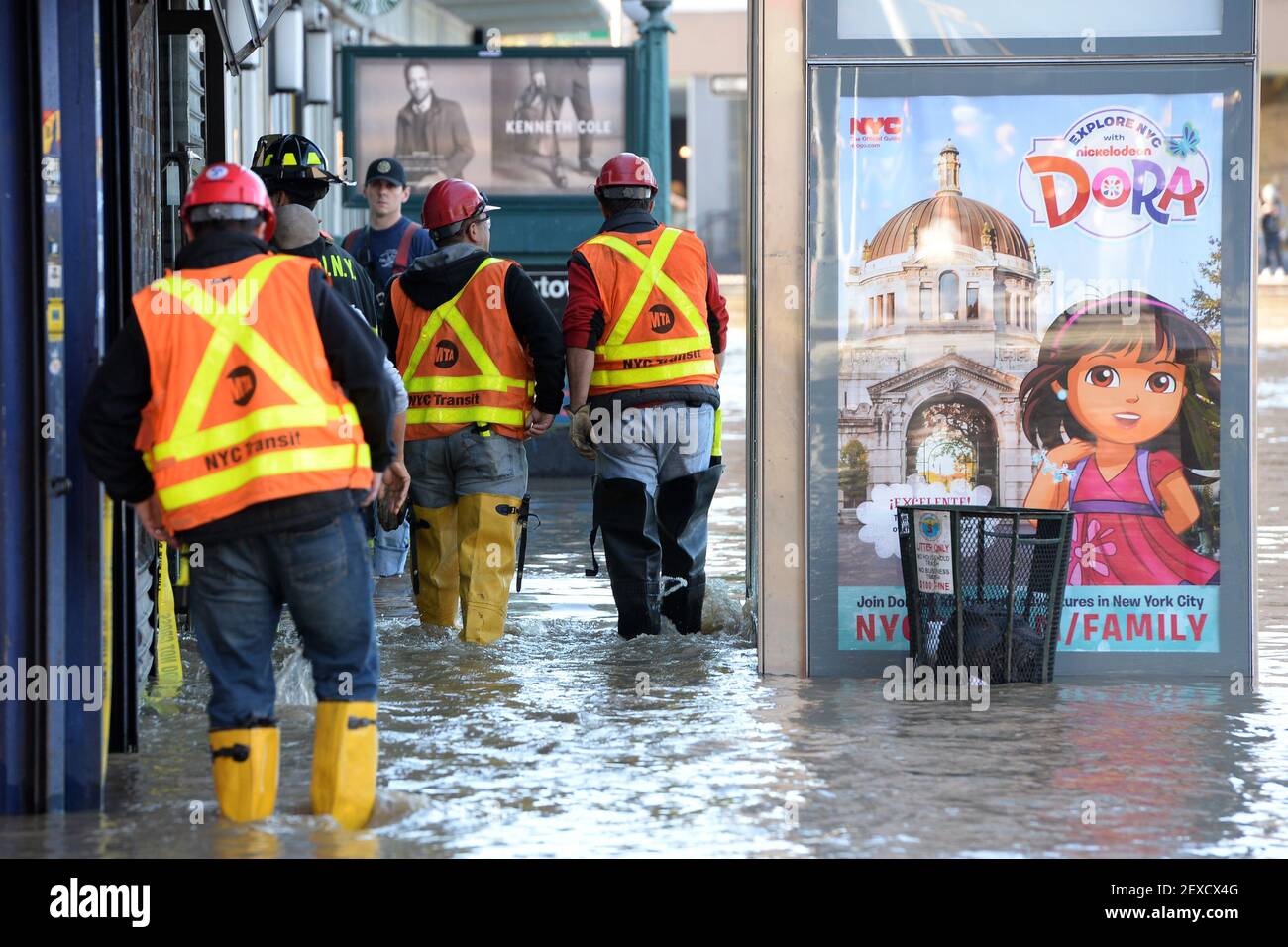 MTA Emergency Response team workers wades through flood waters along ...