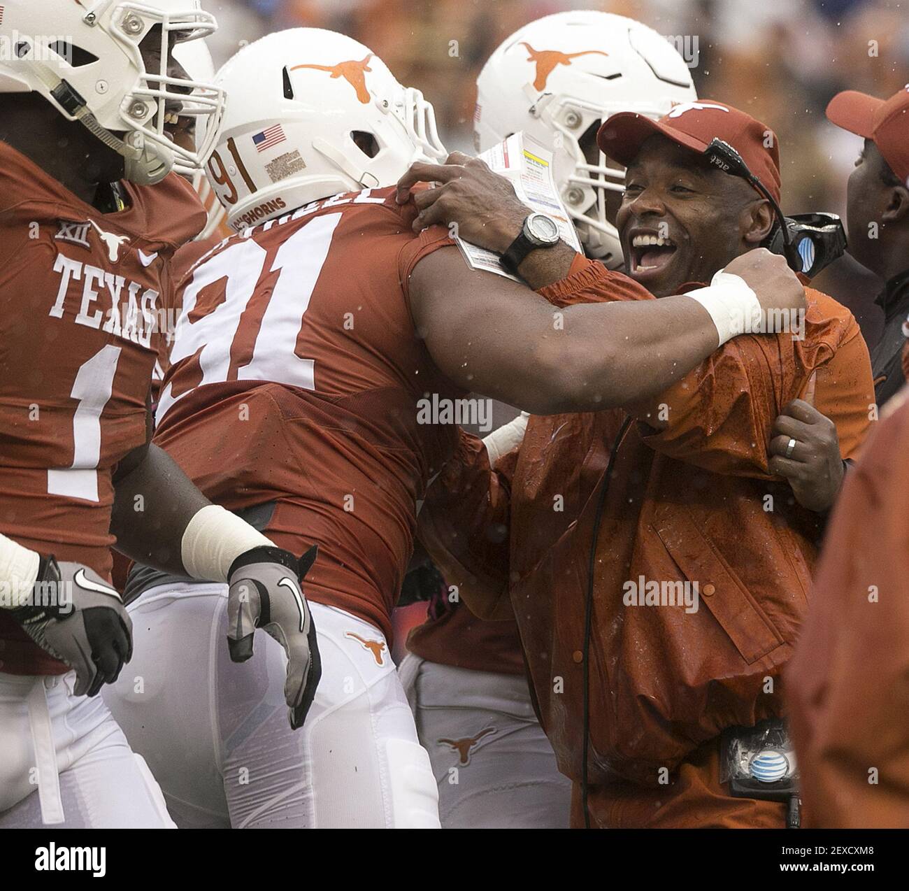 Texas head coach Charlie Strong celebrates with Bryce Cottrell (91 ...