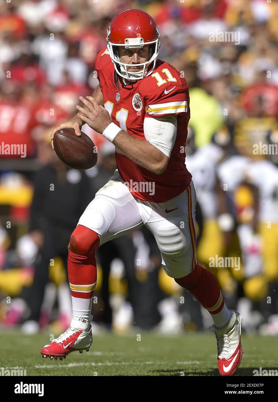 Kansas City Chiefs quarterback Alex Smith (11) runs a bootleg option ...
