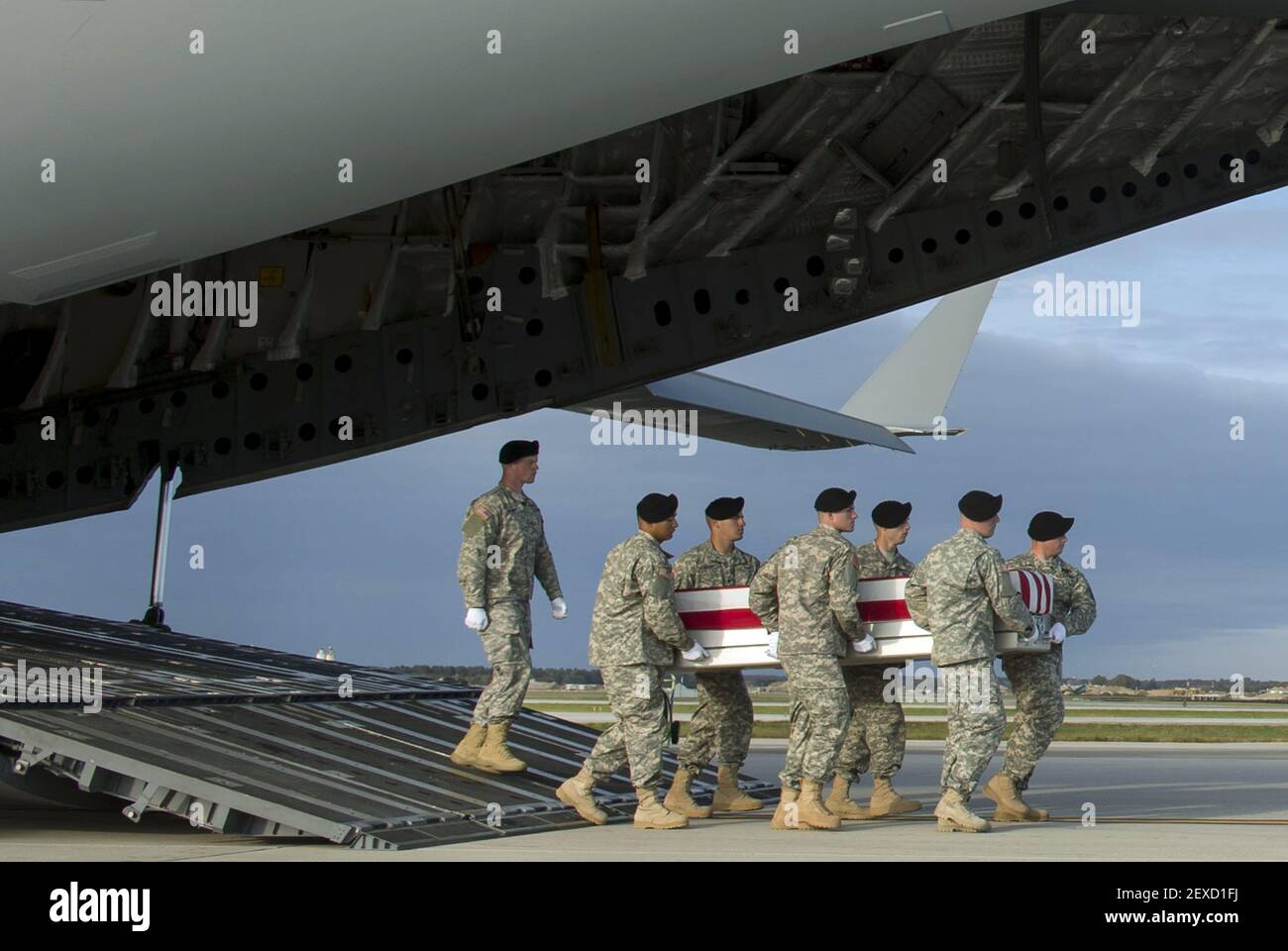 An Army Carry Team moves moves the transfer case of U.S. Army Master ...