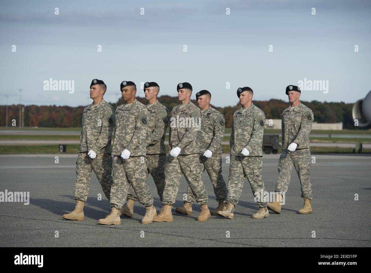 An Army Carry Team moves into place to move the transfer case of U.S ...