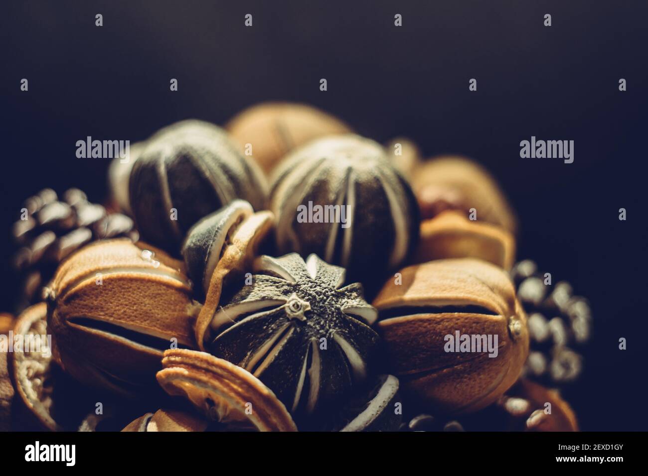 Dried and cut fruits artistic composition in warm light and on dark ...