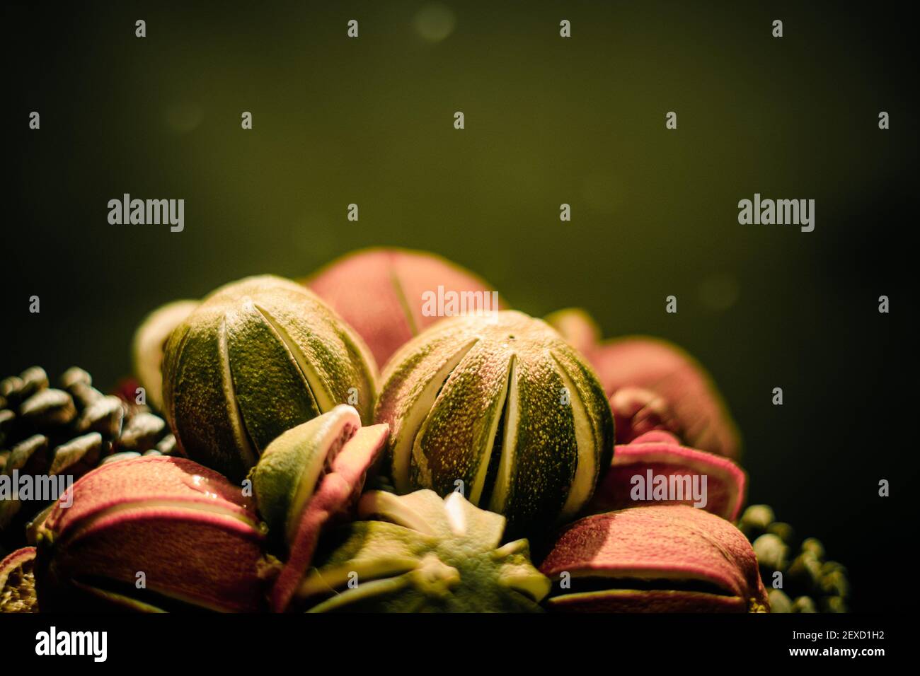 Dried and cut fruits artistic composition in warm light and on dark ...
