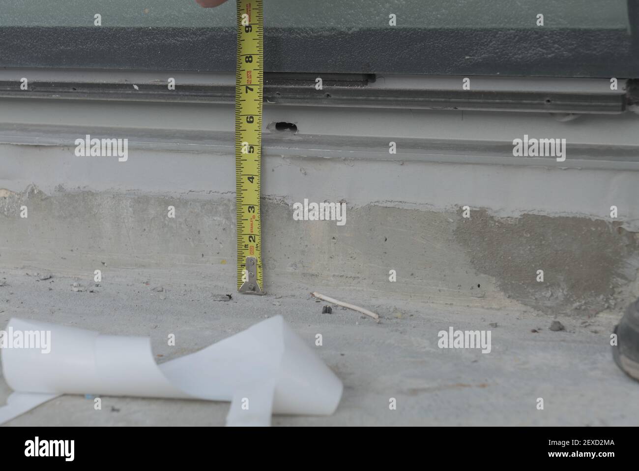 The measuring of the height of the floor with a tape measure Stock ...
