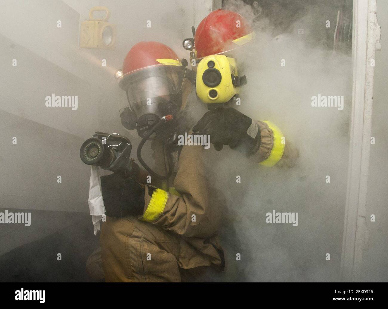 TIMOR SEA (July 9, 2015) Damage Controlman Fireman Nicholas Olivera ...