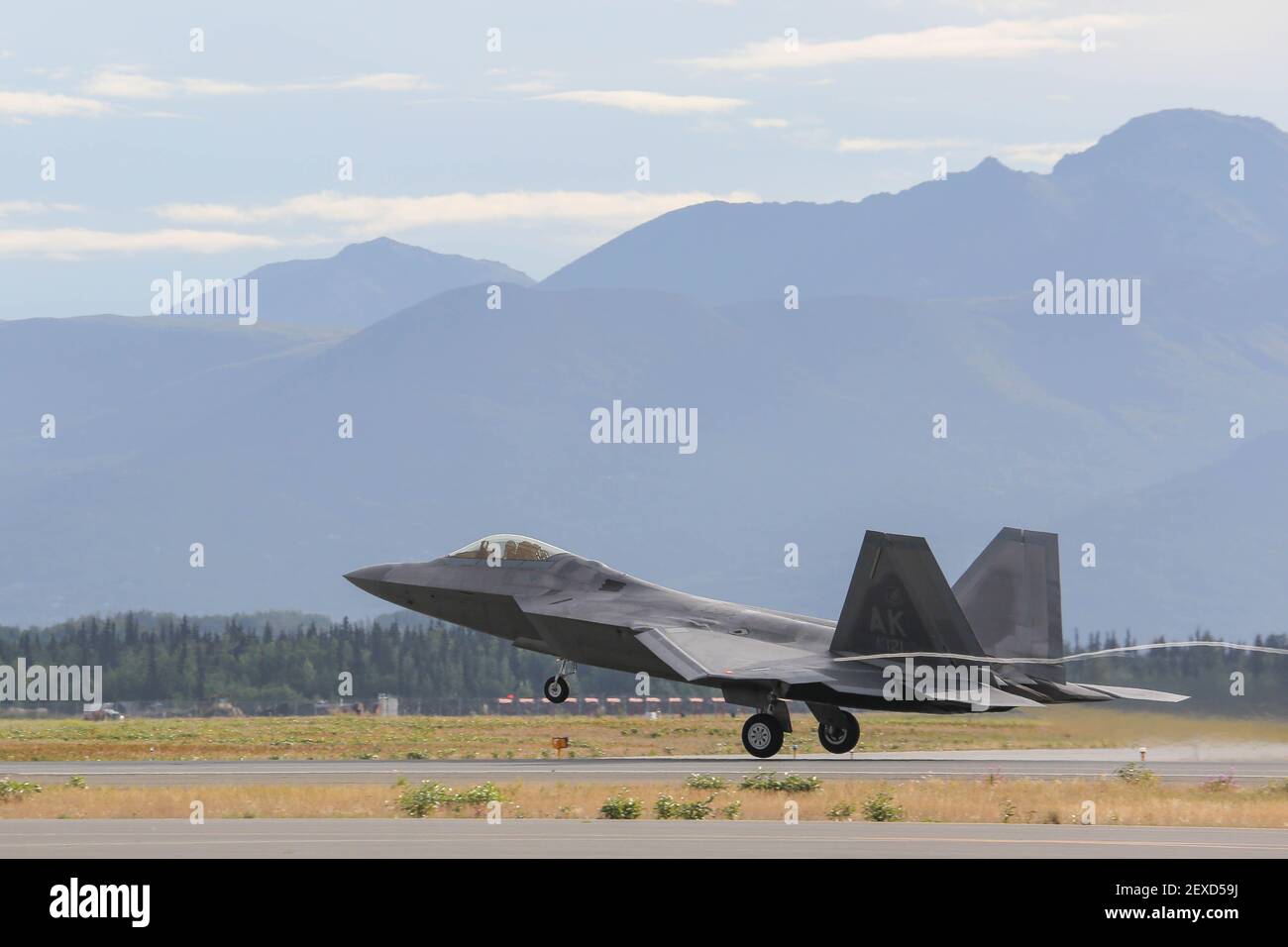 An F-22 Raptor assigned to the 90th Fighter Squadron takes off from ...