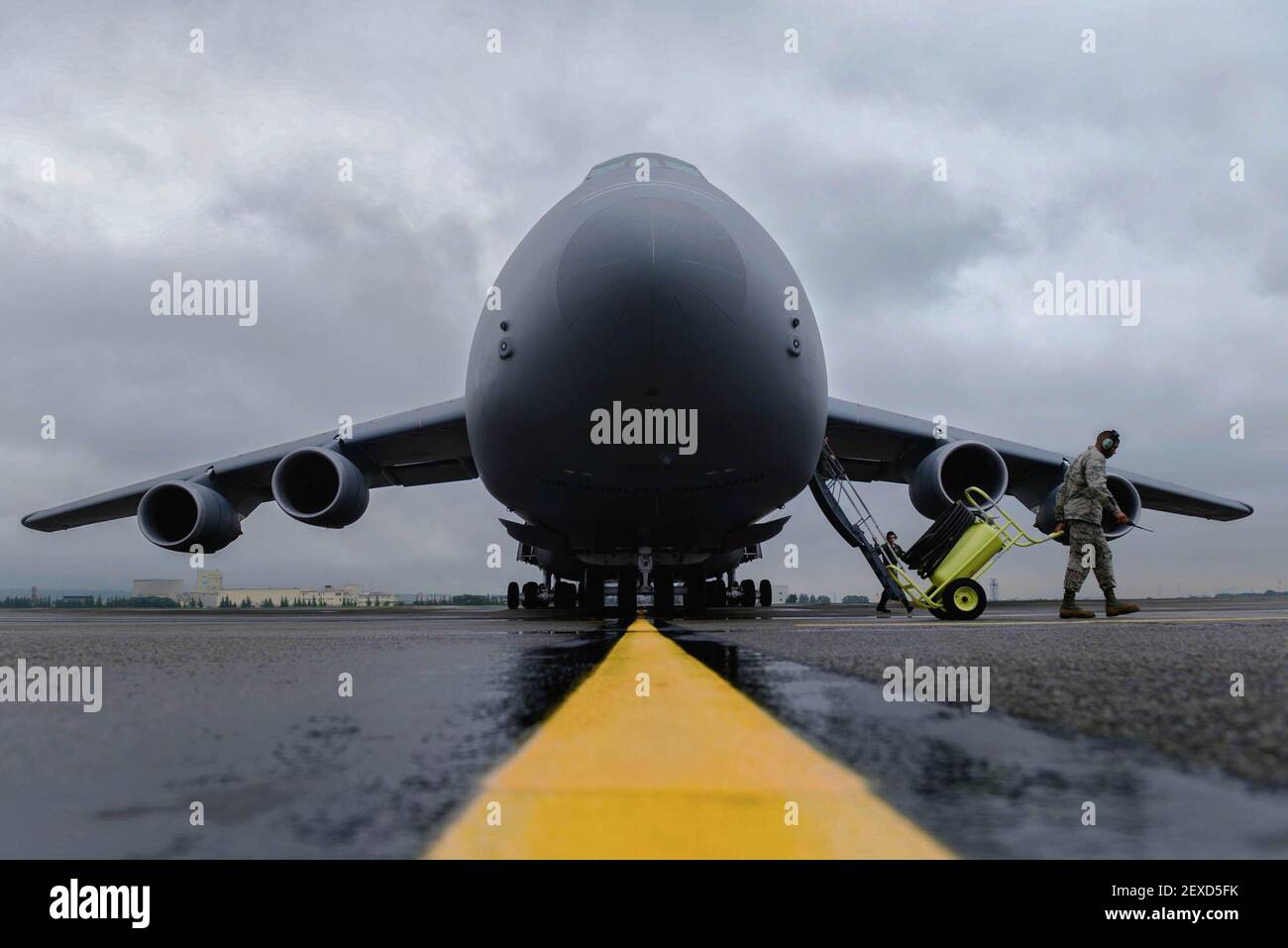 Staff Sgt. Randall Ard, 730th Air Mobility Squadron crew chief, clears ...