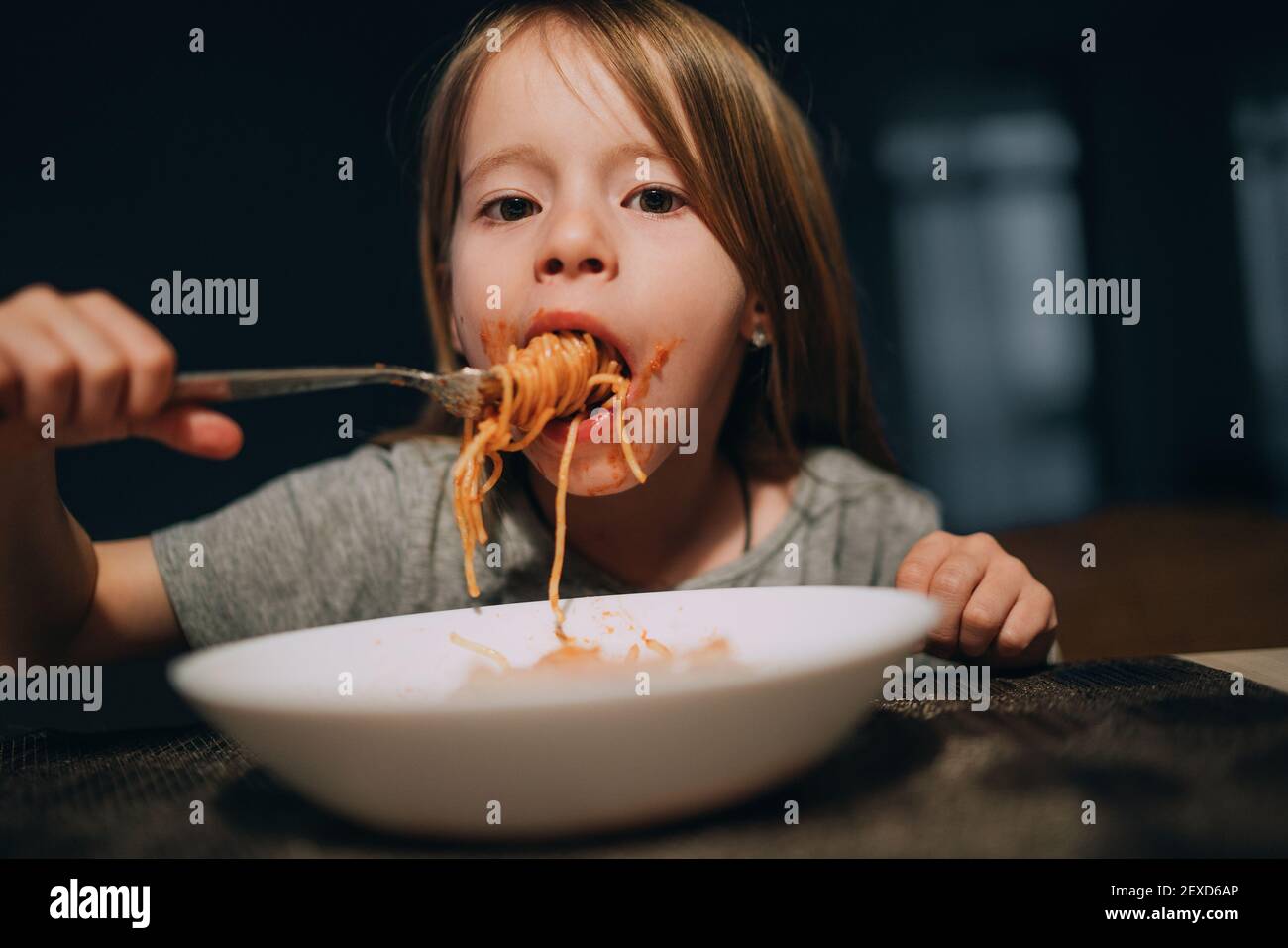 Child eating spaghetti bolognese hi-res stock photography and images ...