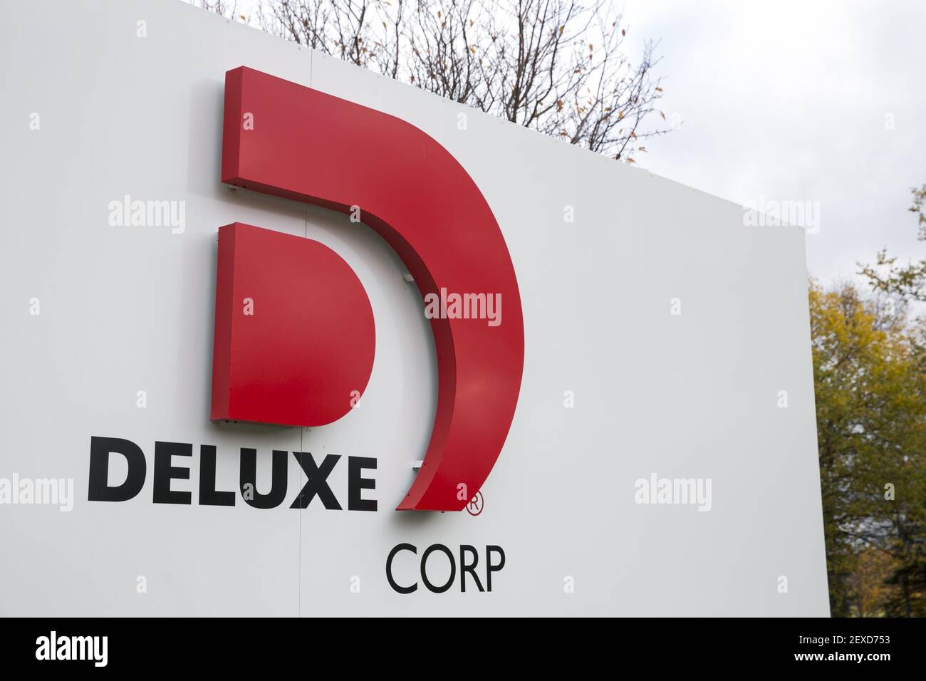 A logo sign outside of the headquarters of the Deluxe Corporation in ...