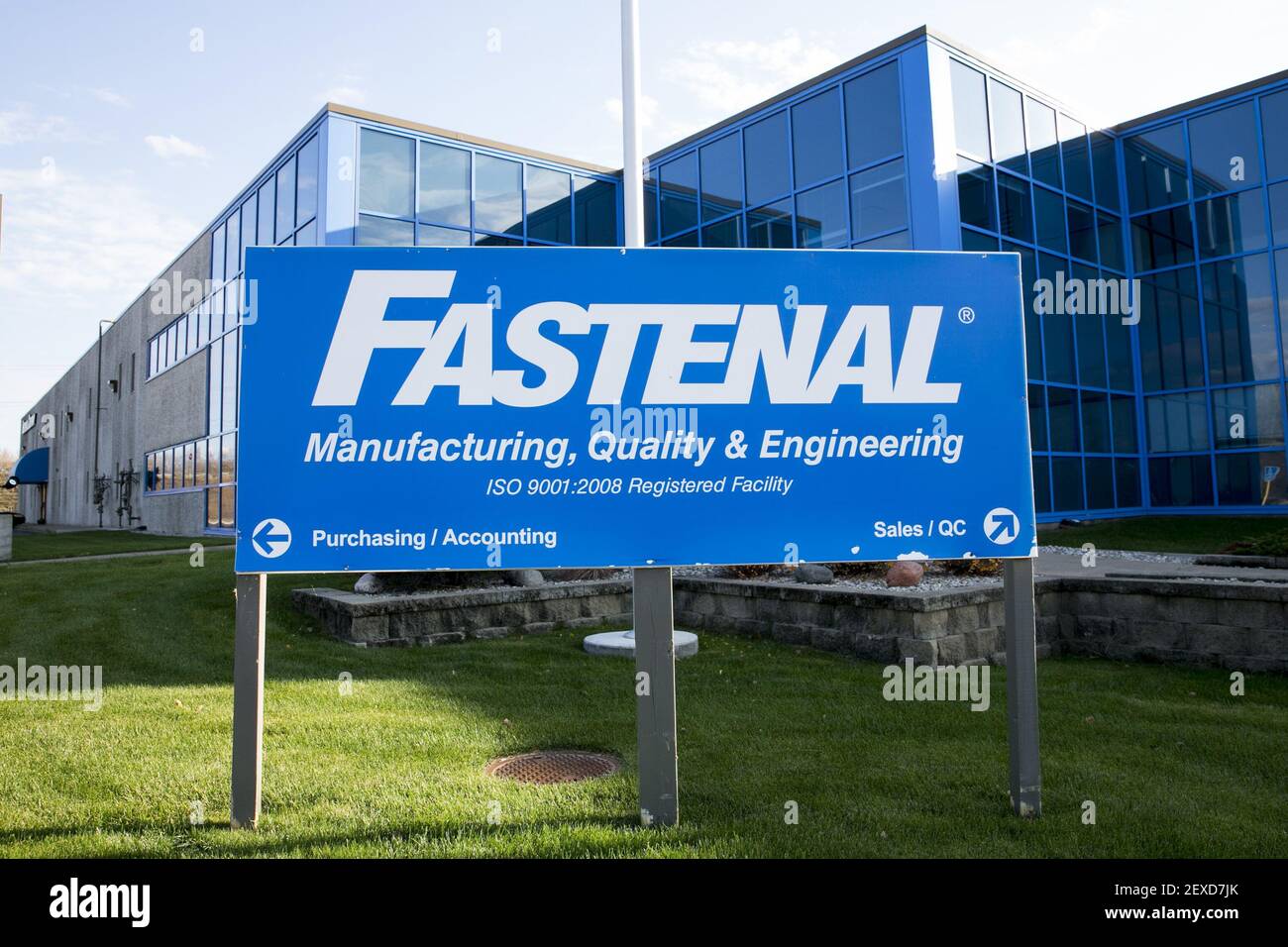 A logo sign outside of the headquarters of the Fastenal Company in ...