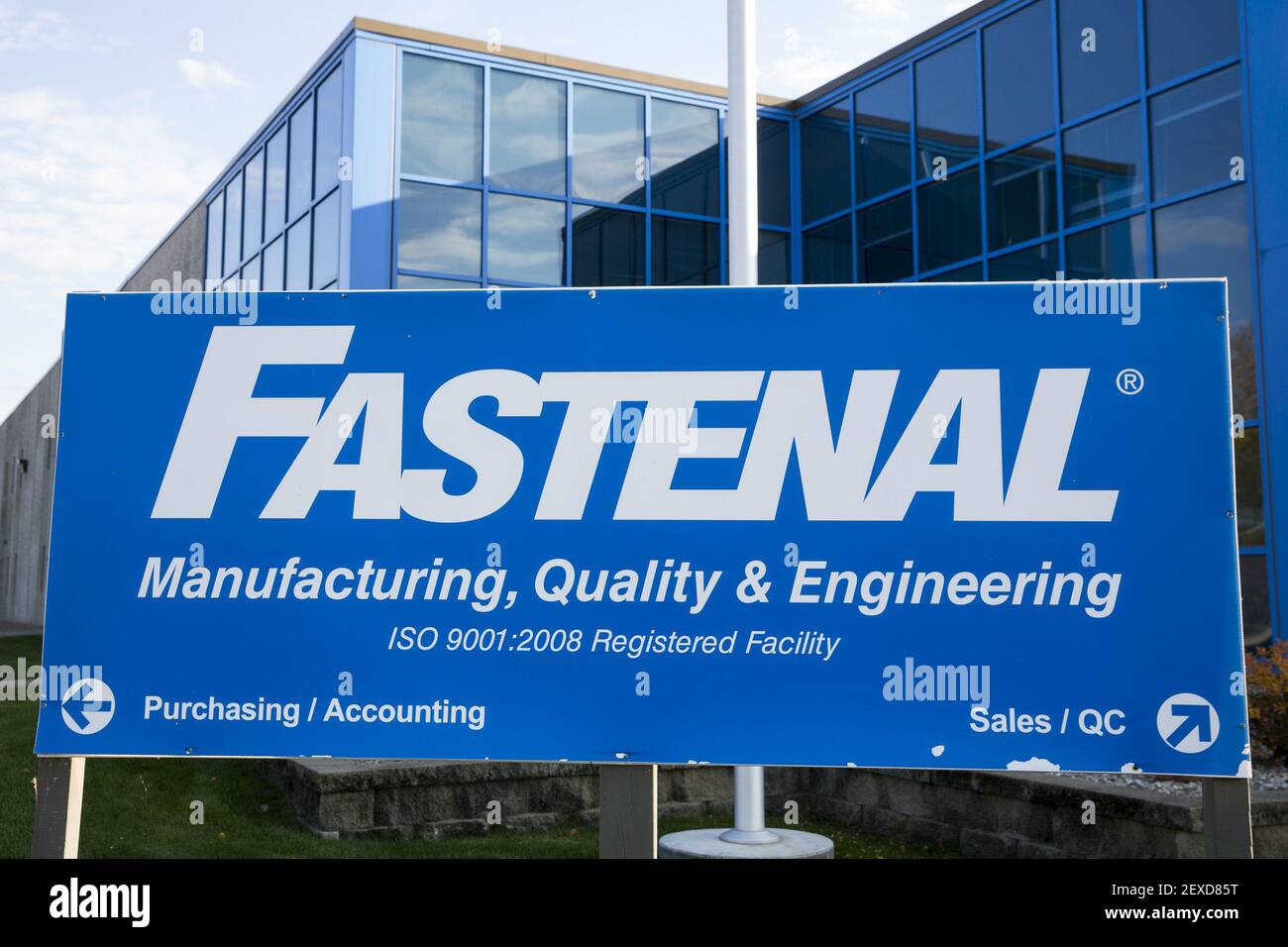 A logo sign outside of the headquarters of the Fastenal Company in ...