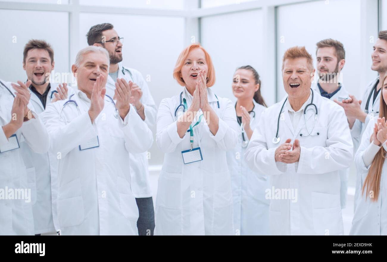 group of medical colleagues applauding their overall success Stock ...