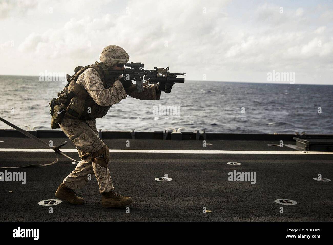 Marine Joseph Burk fires at his target on the move during a short-range ...