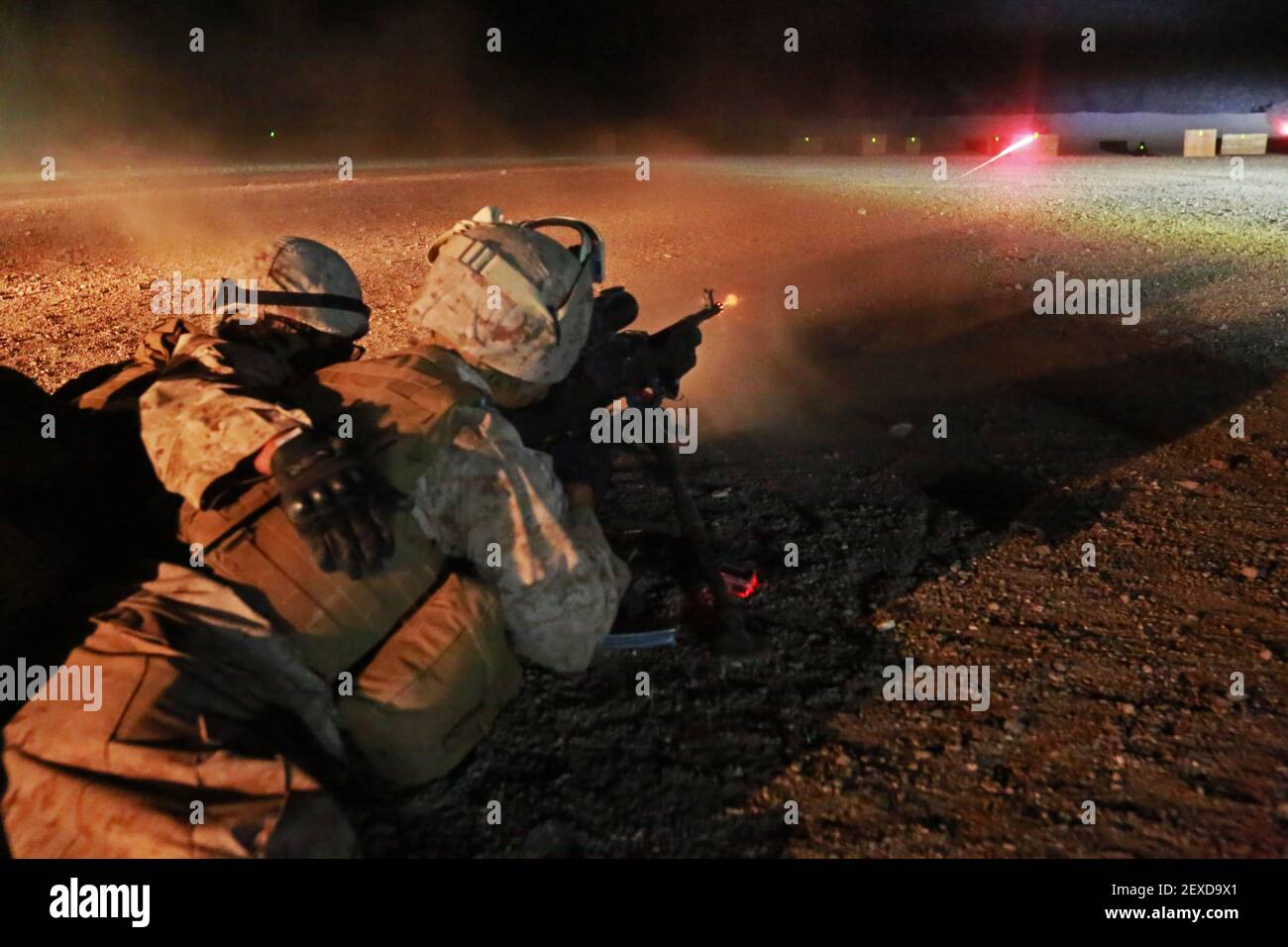 Lance Cpl. Zachary Palacio engages his target with an M240B squad ...