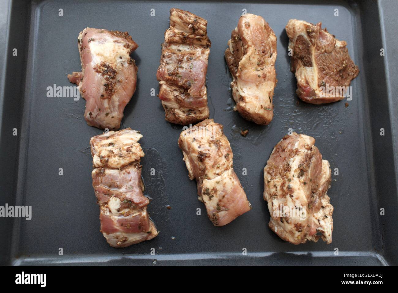 Marinated pork ribs on a baking sheet Stock Photo - Alamy