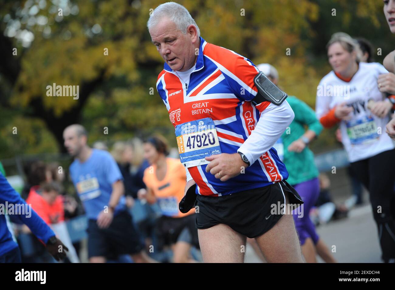 A runner in a "Union Jack" shirt turns onto Central Park South in ...