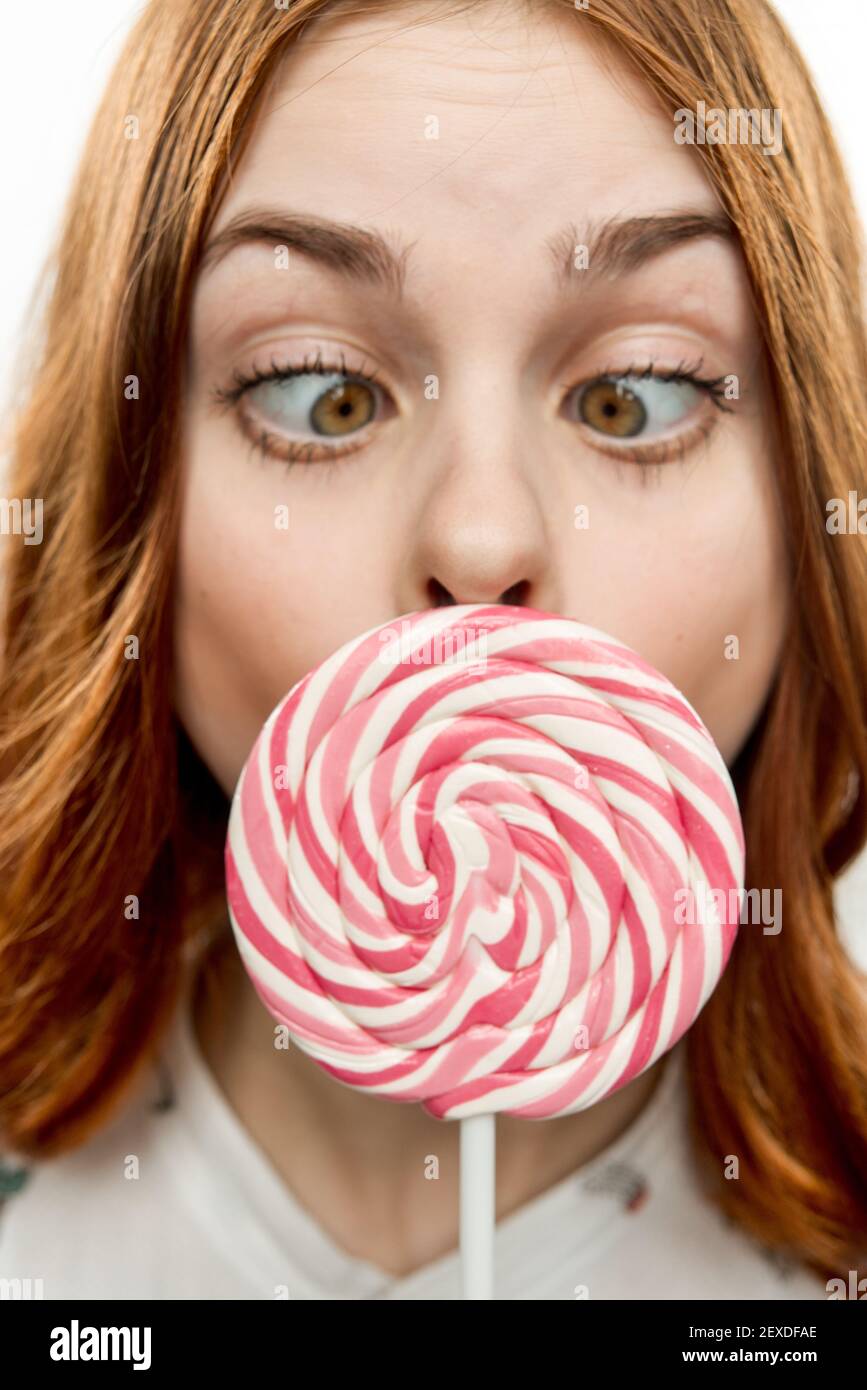 woman with open mouth holds lollipop near face Sweets joy Stock Photo ...