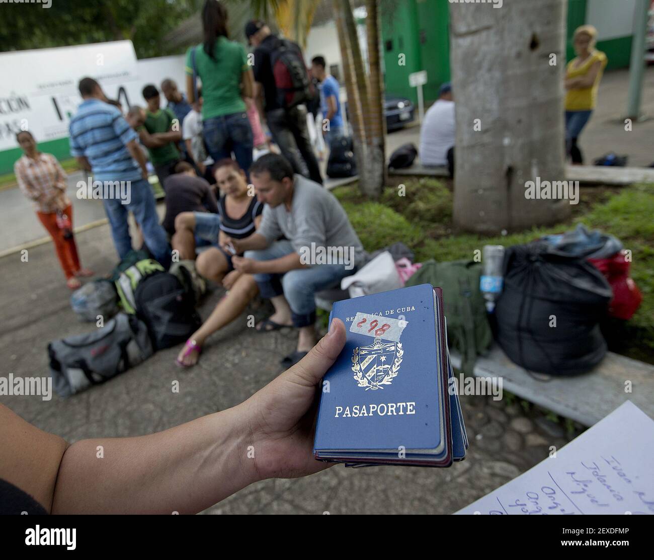 A stack of passports from Cuban migrants waiting to be processed ...