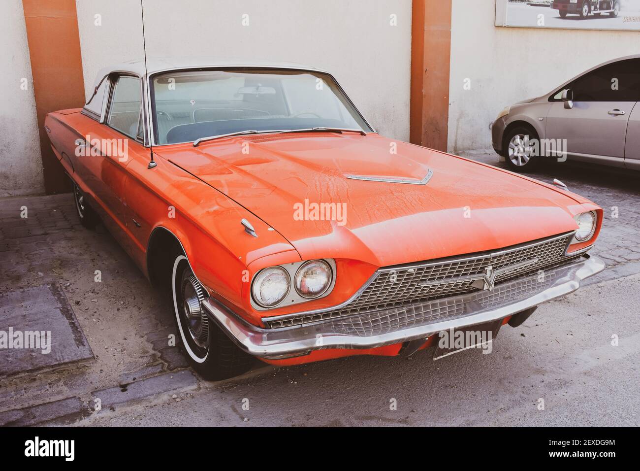 Front side view of a red classic car in the street Stock Photo - Alamy