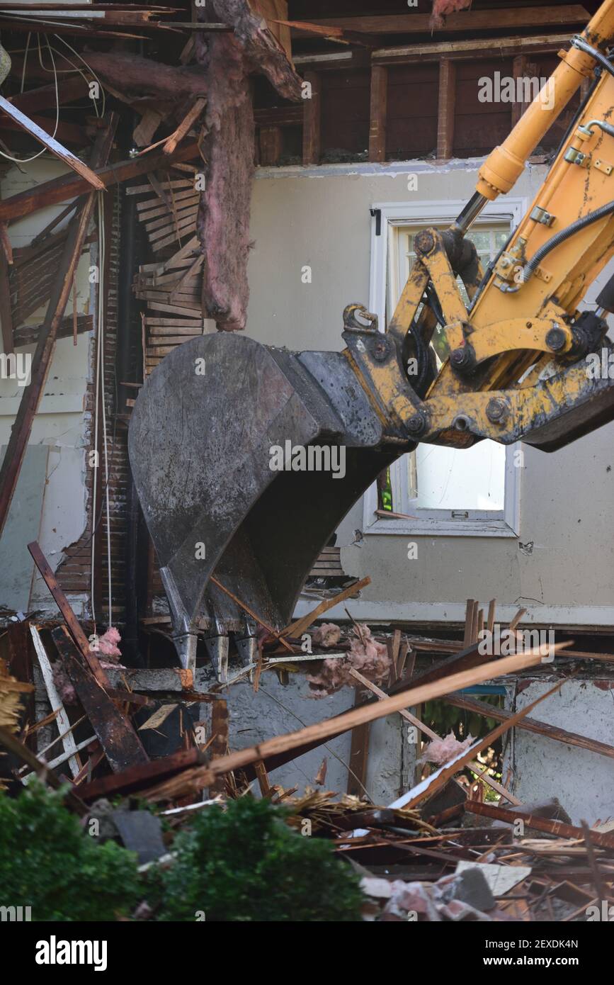 A demolition crew with Dan Riehl Excavating tears down a house at 633 ...