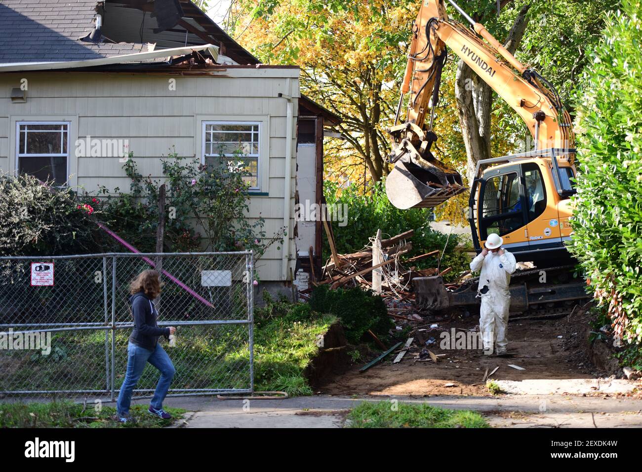 A demolition crew with Dan Riehl Excavating tears down a house at 633 ...