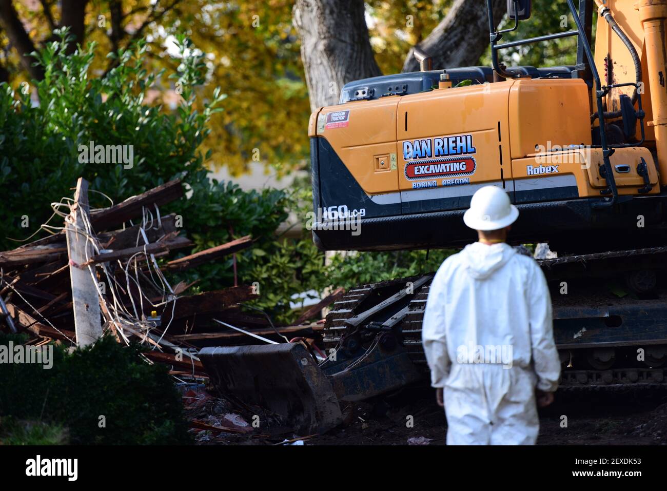 A demolition crew with Dan Riehl Excavating tears down a house at 633 ...