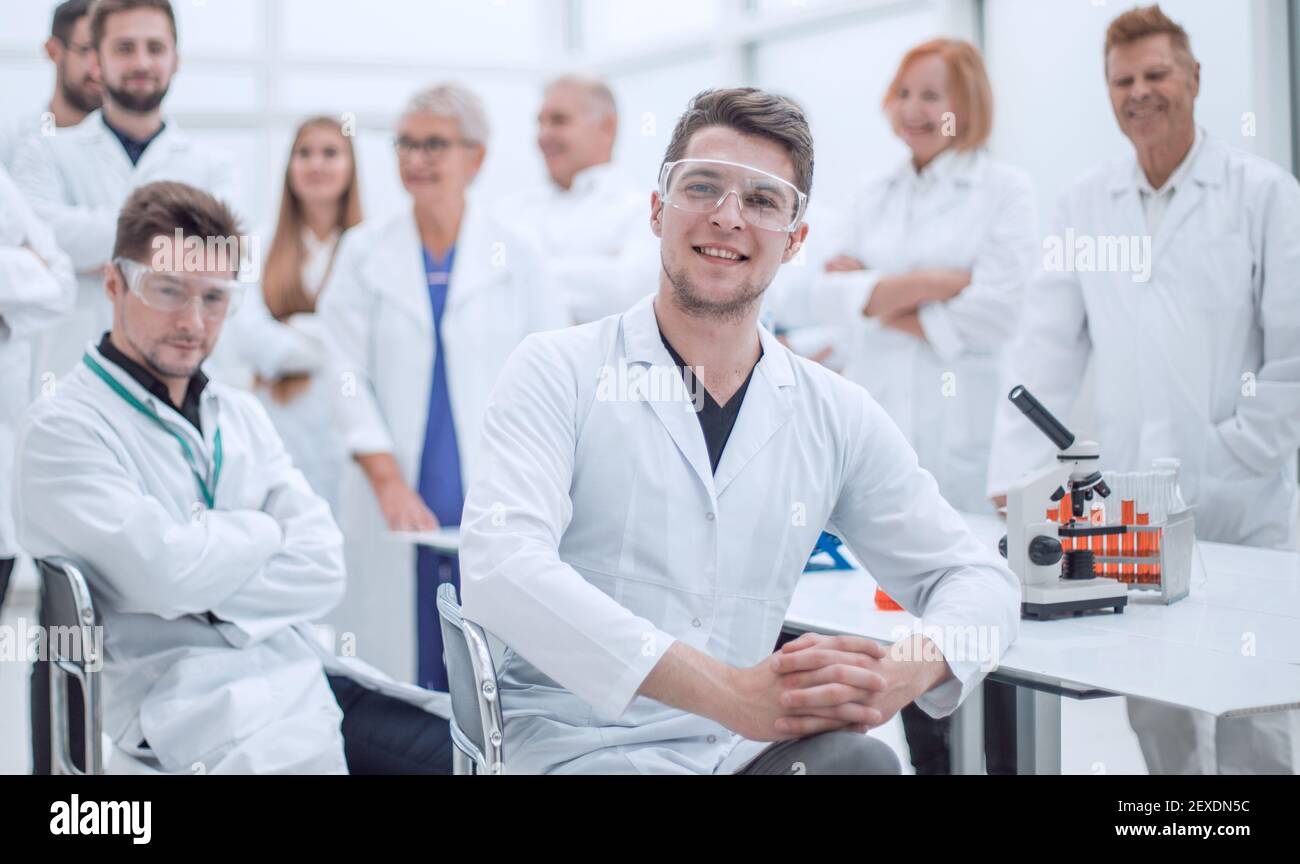 best researcher and his colleagues in the workplace Stock Photo - Alamy