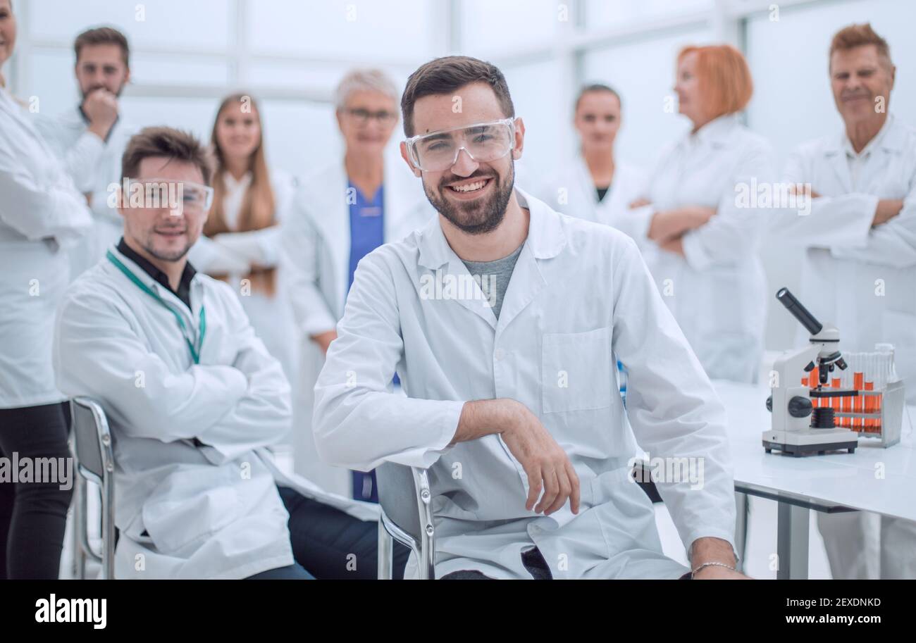 best researcher and his colleagues in the workplace Stock Photo - Alamy