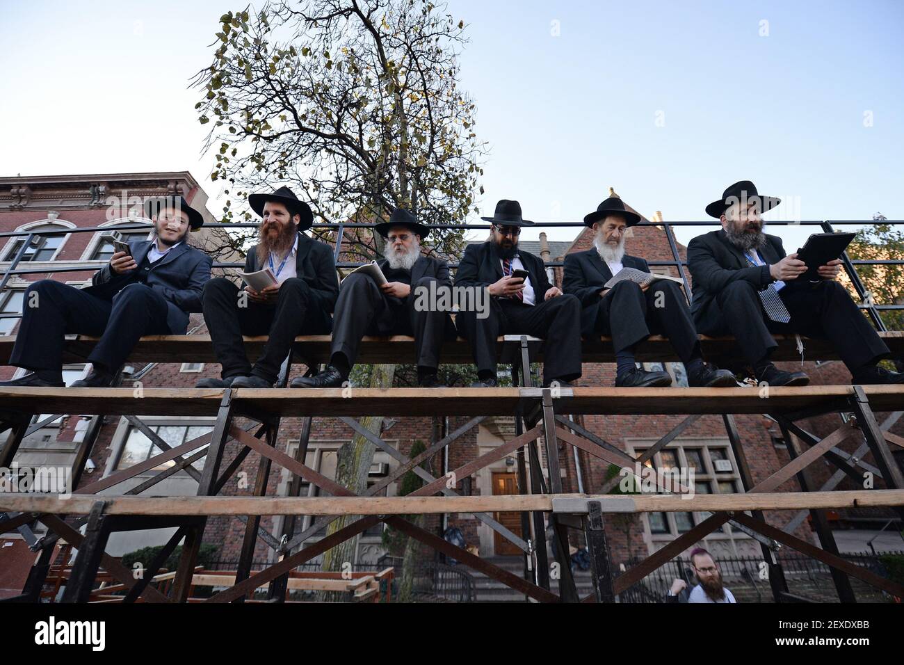 Six rabbis take an early seat along rafters that will hold thousands of ...