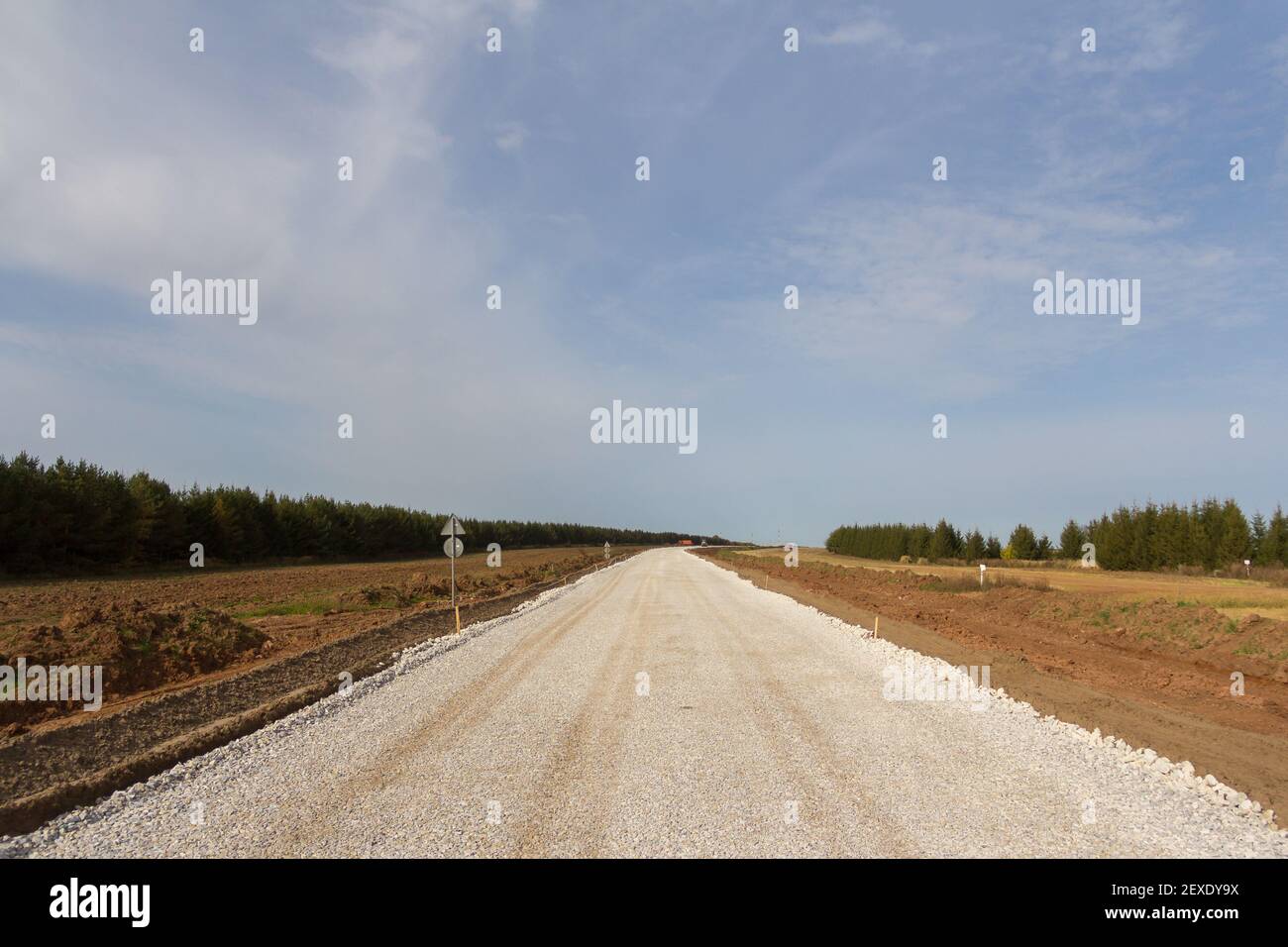 Construction of a new road. Construction stage. Road pavement layers ...