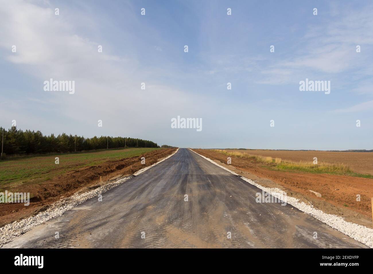 Construction of a new road. Construction stage. Road pavement layers ...