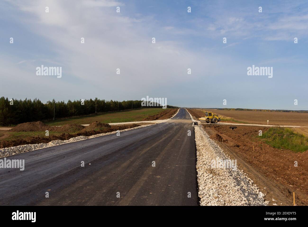Construction of a new road. Construction stage. Road pavement layers ...