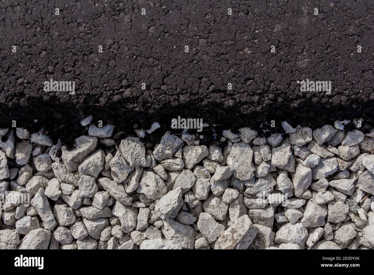 New motor road. Paved bituminous asphalt based on gravel. Road layers ...