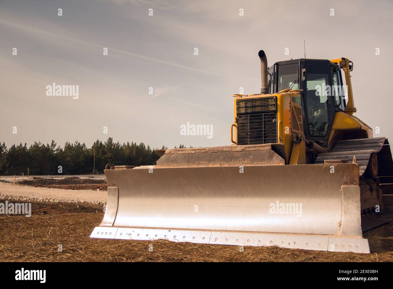 Bulldozer on the construction of a new road. Construction machinery ...