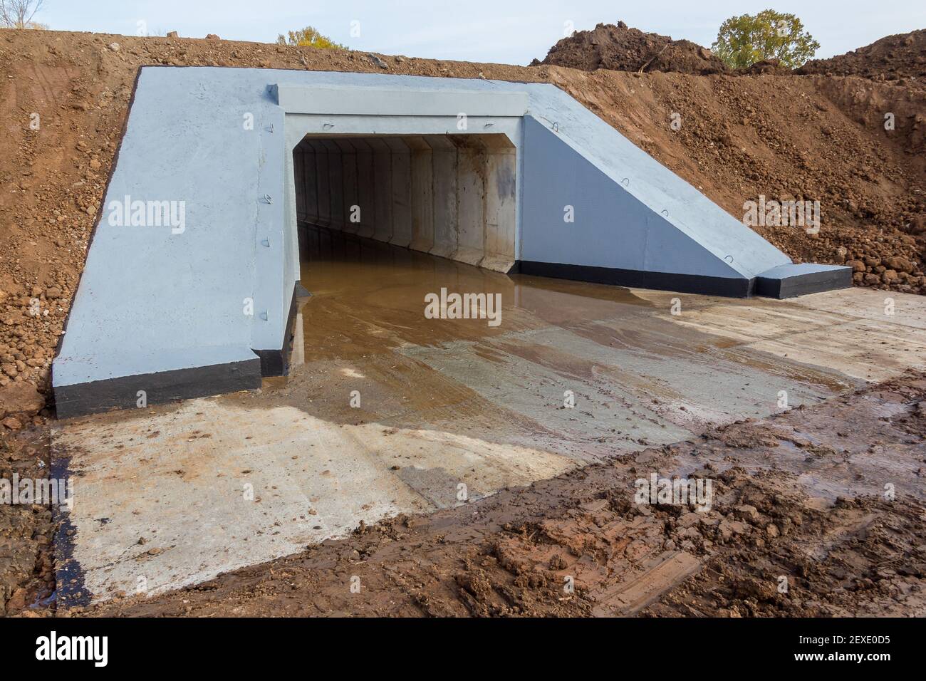 Small concrete bridge across the road. A bridge across a road for a ...